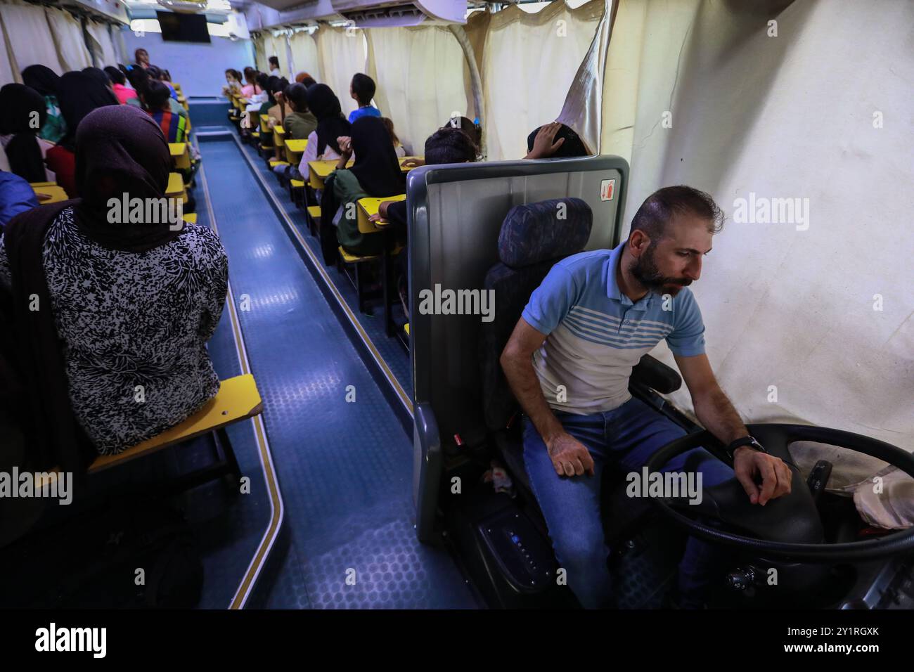 08 September 2024, Iraq, Baghdad: Children attend a class inside the ...