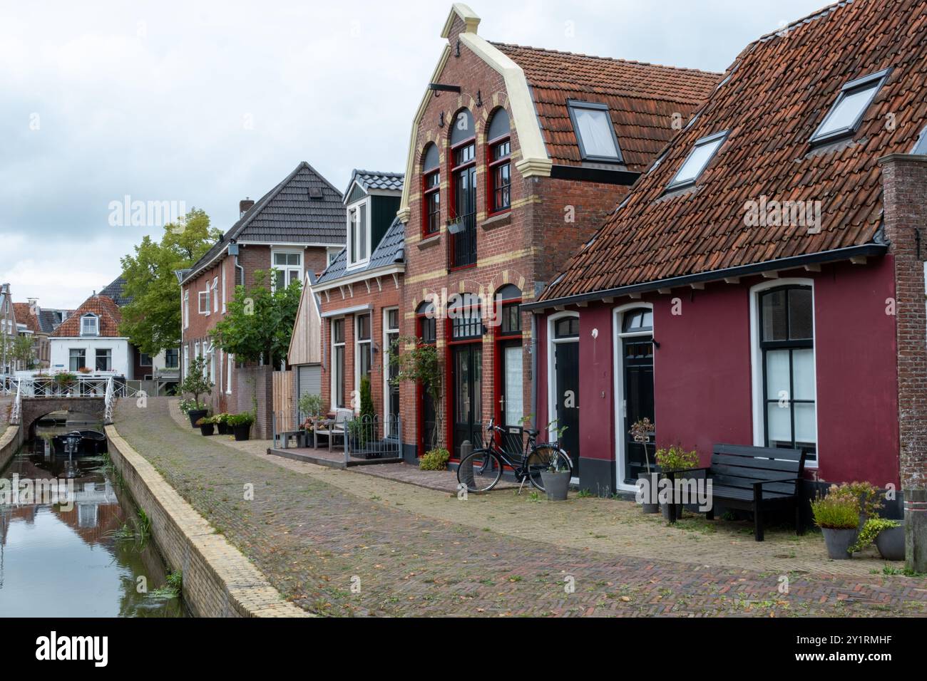 canal with residential buildings in a dutch town Stock Photo - Alamy