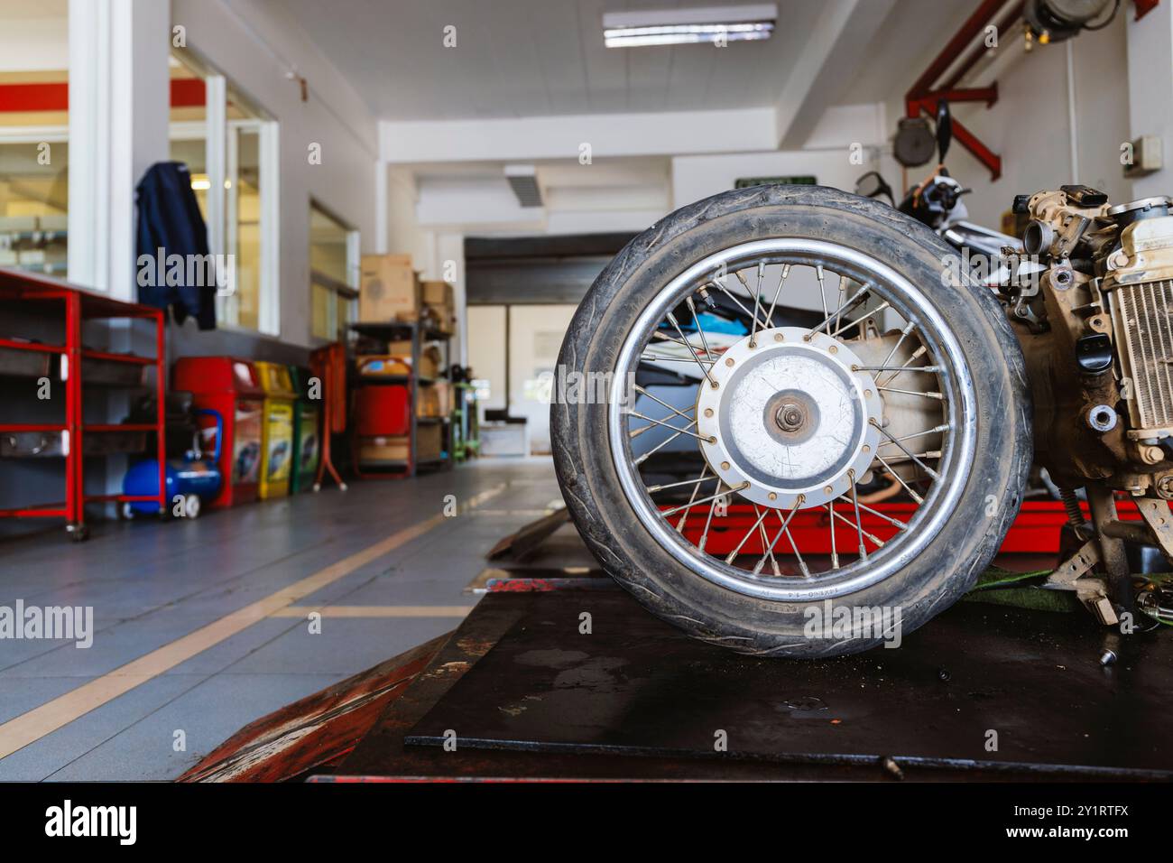 Motorcycle Wheel in a Garage Workshop Stock Photo - Alamy