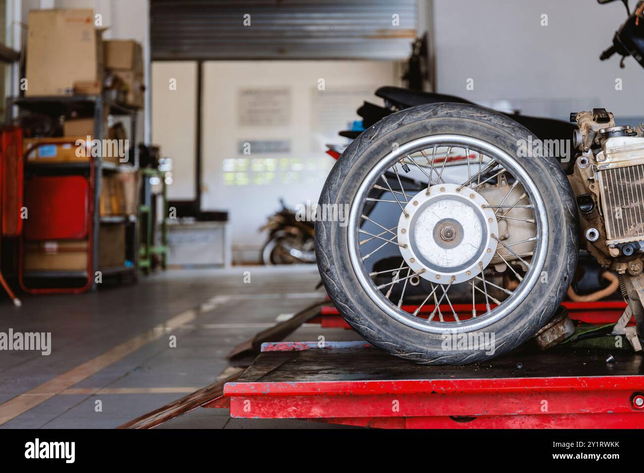 Motorcycle Wheel in a Garage Workshop Stock Photo - Alamy