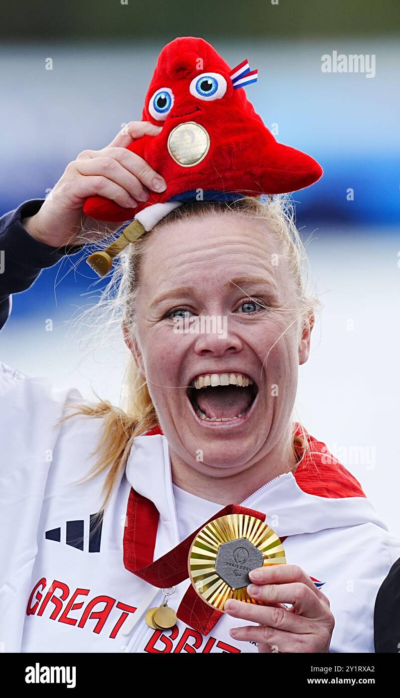 Great Britain's Laura Sugar celebrates with the gold medal on the ...