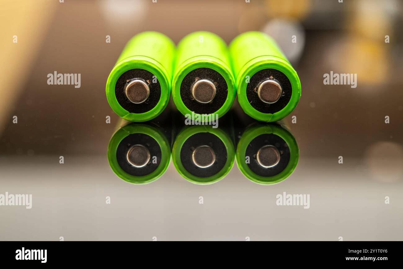 Rechargeable AAA batteries in vibrant green, symbolizing renewable ...