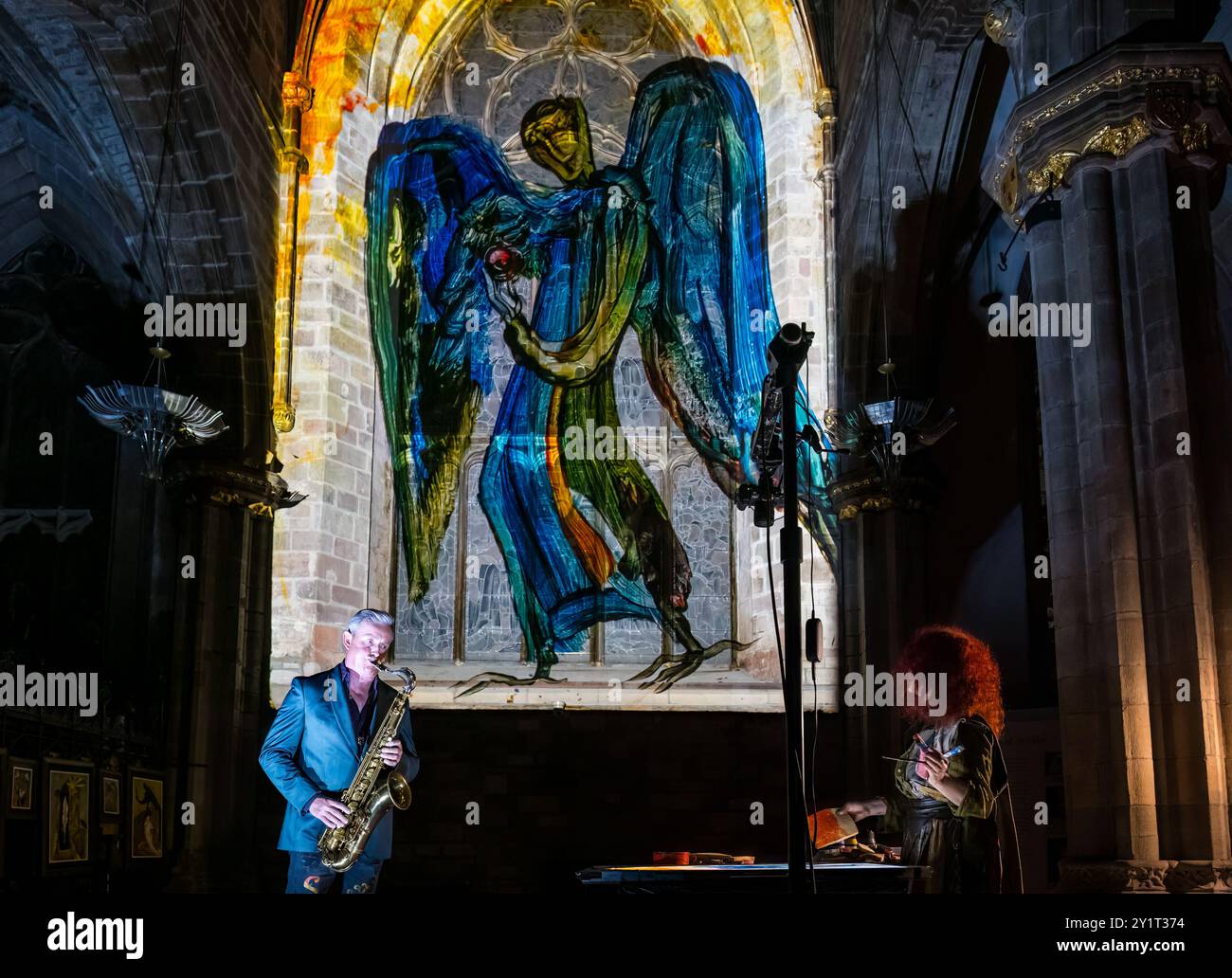 Saxophonist Tommy Smith performs as artist Maria Rud paints, St Giles ...