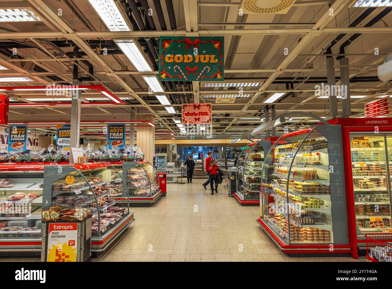 Interior of hypermarket before Christmas with refrigerated displays ...