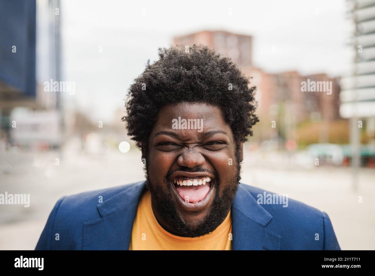 Happy african plus size man smiling on camera outdoor - Body positive ...