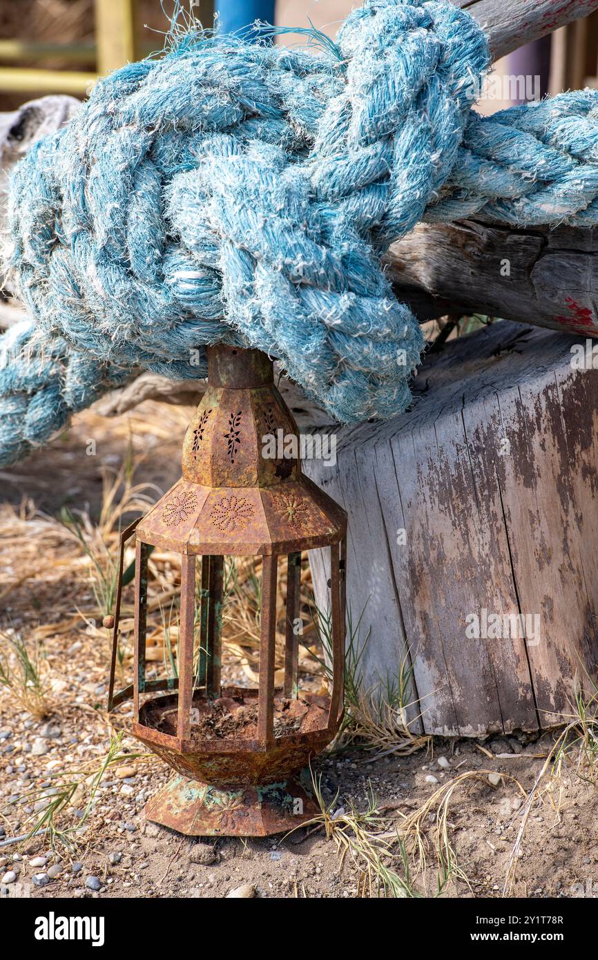 weathered ships rope and old rusty navigation ships lantern in nautical ...