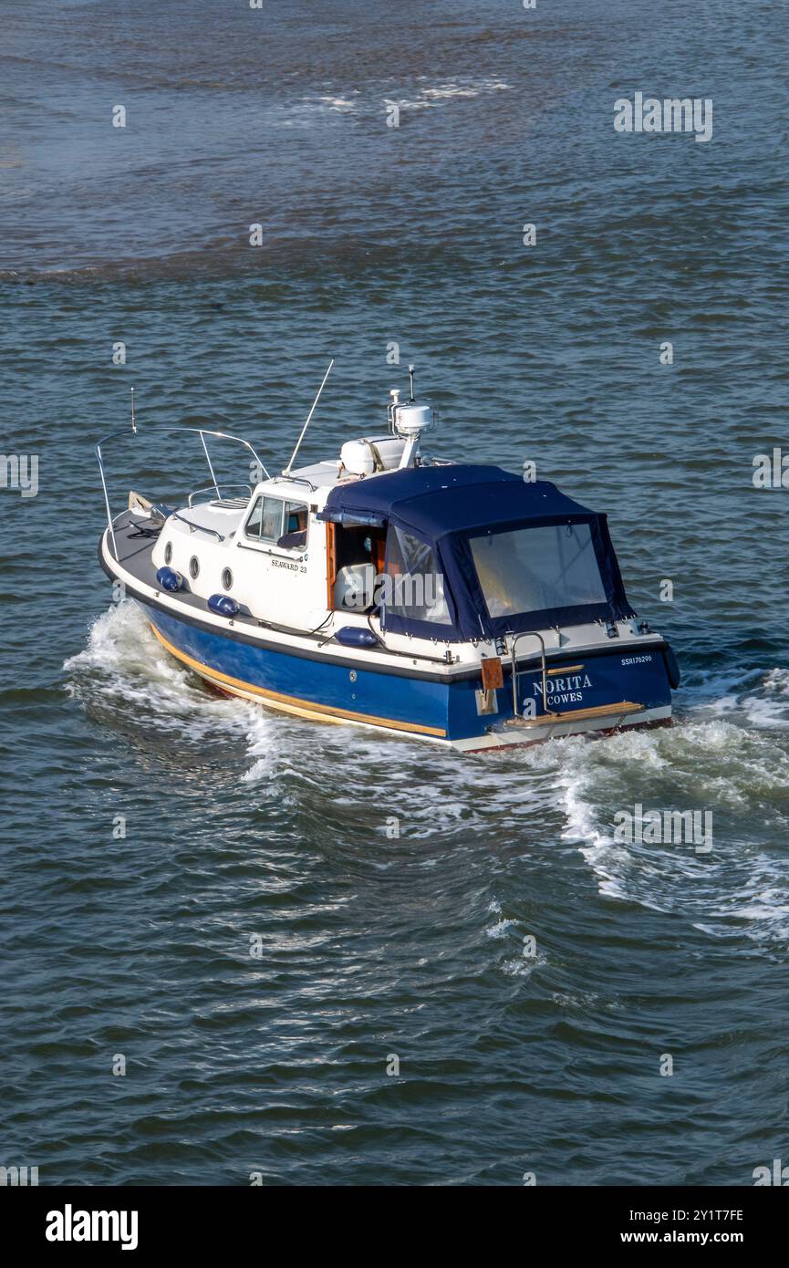 traditional style motorboat cruising in the solent uk Stock Photo - Alamy