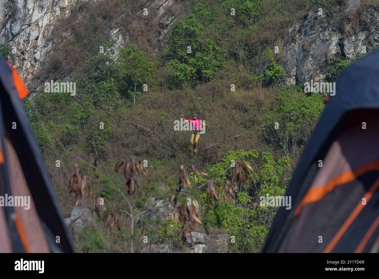 INDONESIA HIGHLINE FESTIVAL Extreme sports athletes walk on a tightrope ...