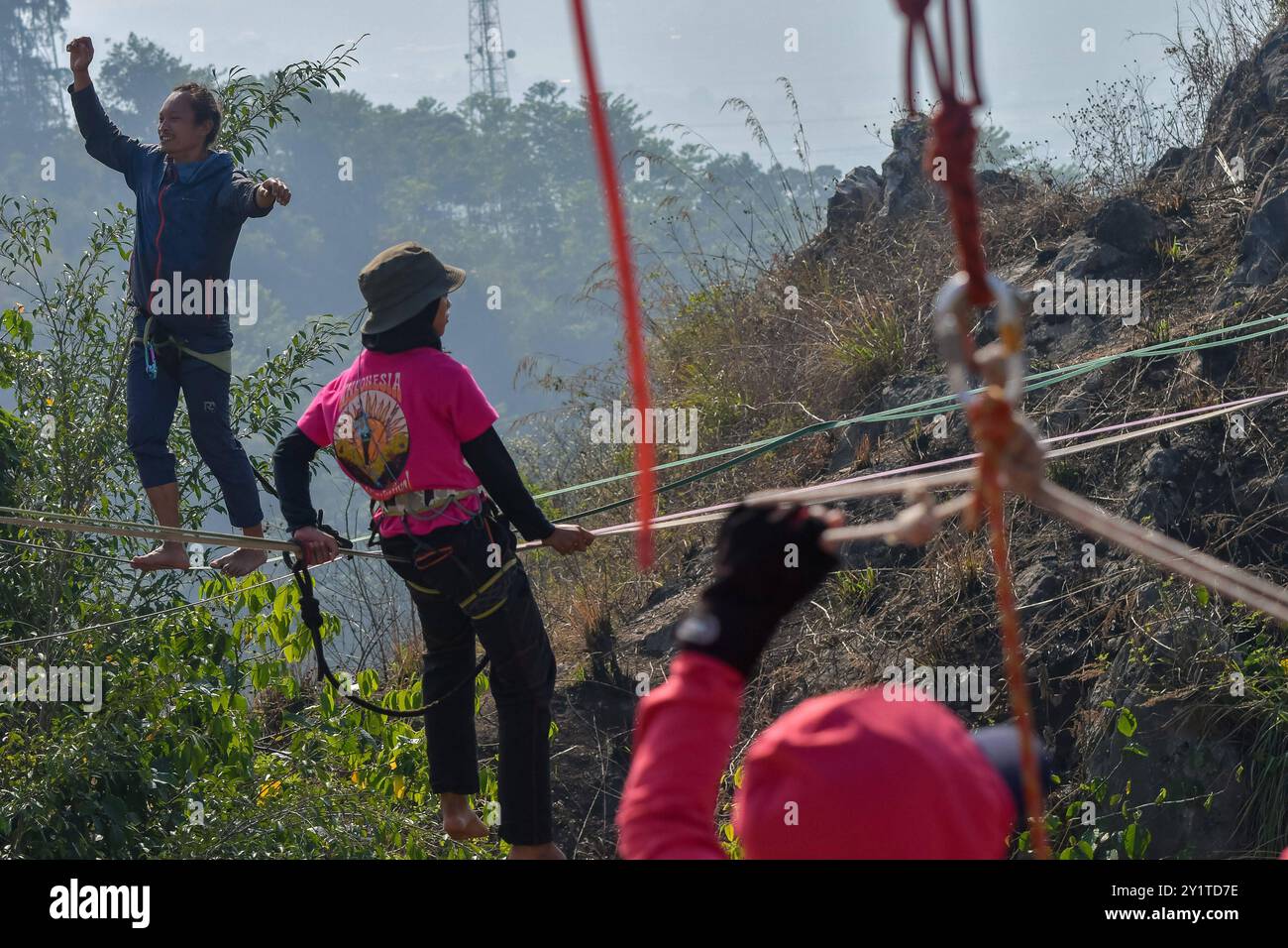 INDONESIA HIGHLINE FESTIVAL Extreme sports athletes walk on a tightrope ...