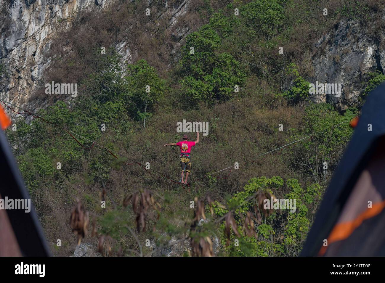 INDONESIA HIGHLINE FESTIVAL Extreme sports athletes walk on a tightrope ...