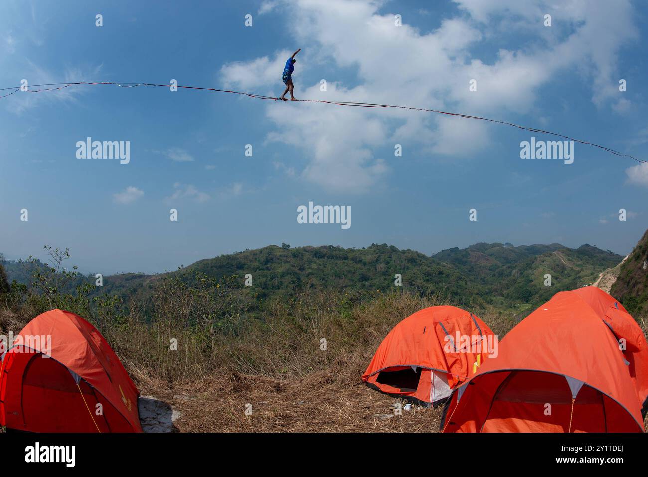 INDONESIA HIGHLINE FESTIVAL Extreme sports athletes walk on a tightrope ...