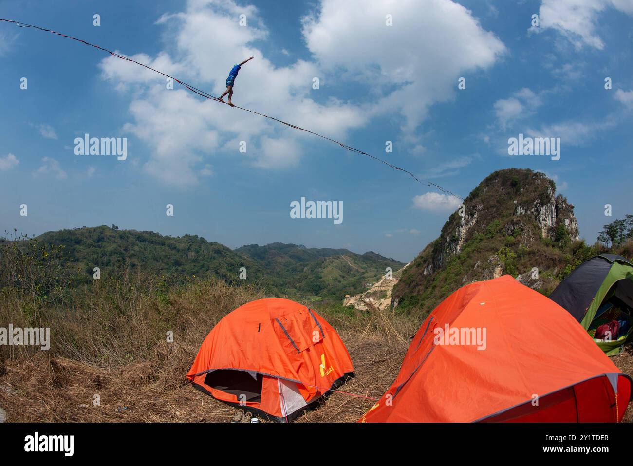 INDONESIA HIGHLINE FESTIVAL Extreme sports athletes walk on a tightrope ...