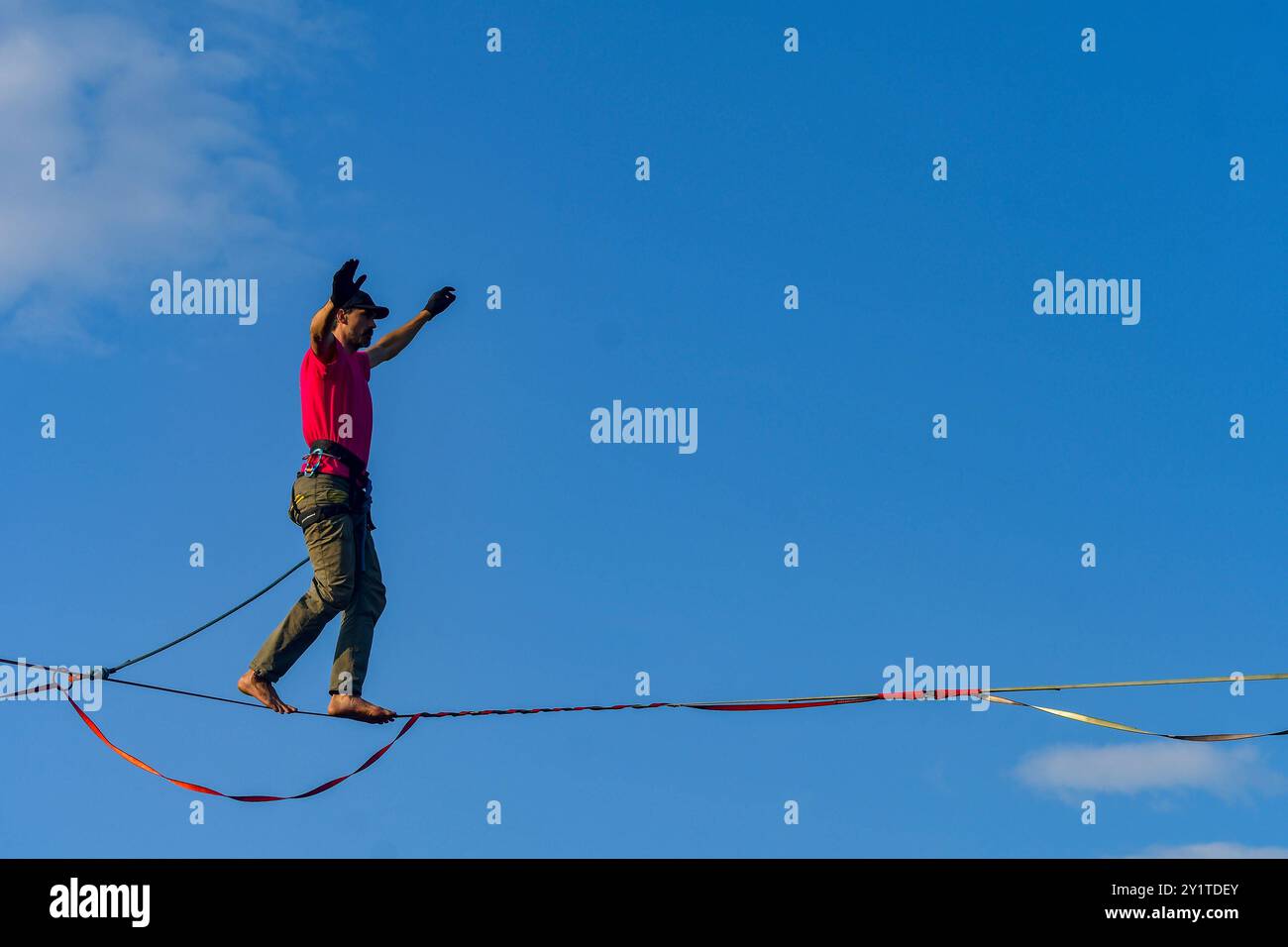 INDONESIA HIGHLINE FESTIVAL Extreme sports athletes walk on a tightrope ...