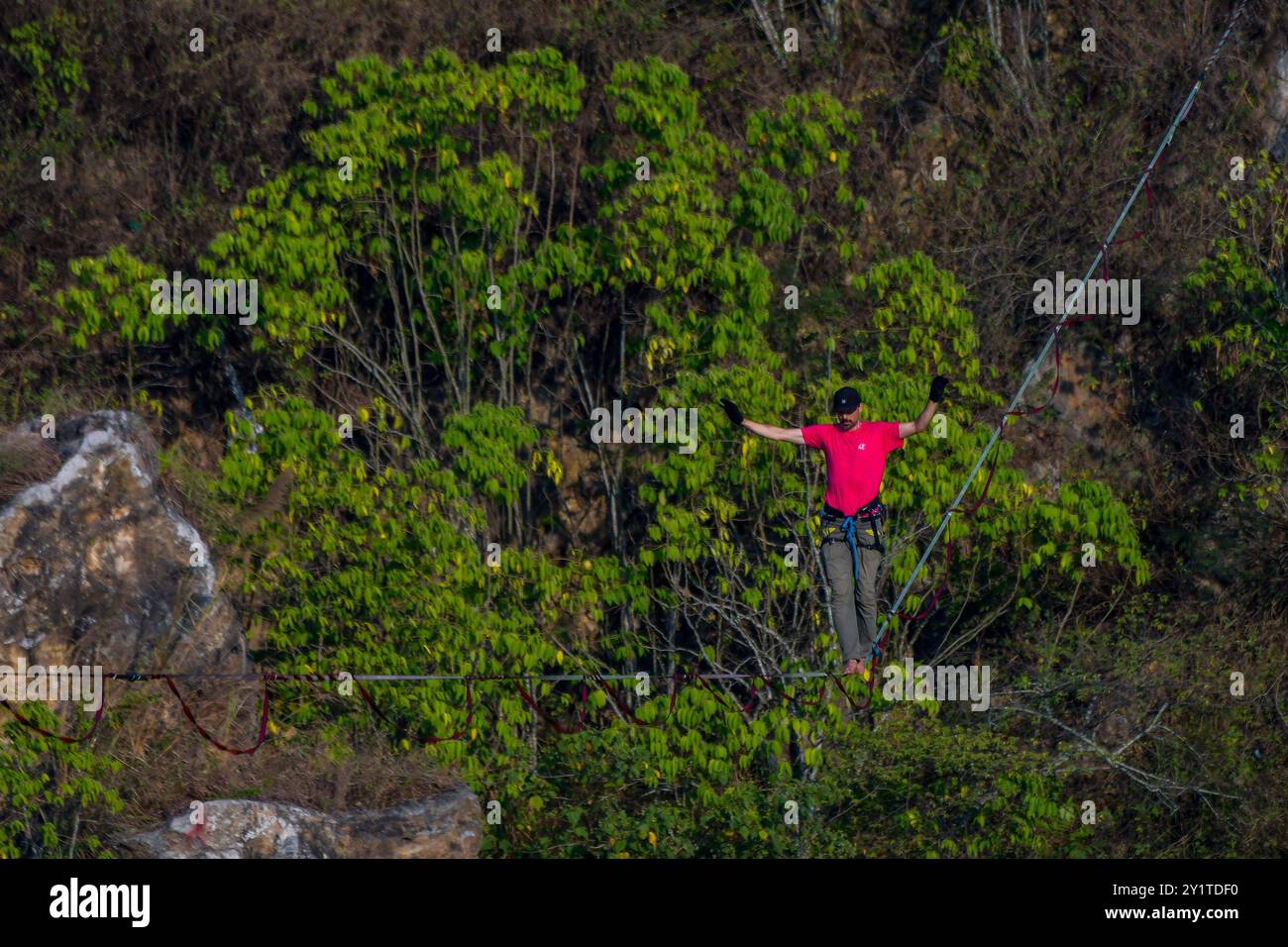 INDONESIA HIGHLINE FESTIVAL Extreme sports athletes walk on a tightrope ...