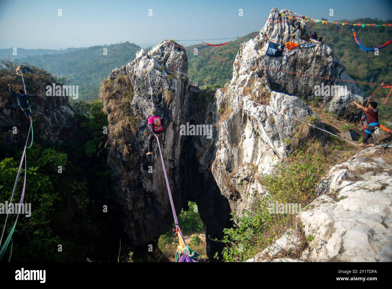 INDONESIA HIGHLINE FESTIVAL Extreme sports athletes walk on a tightrope ...