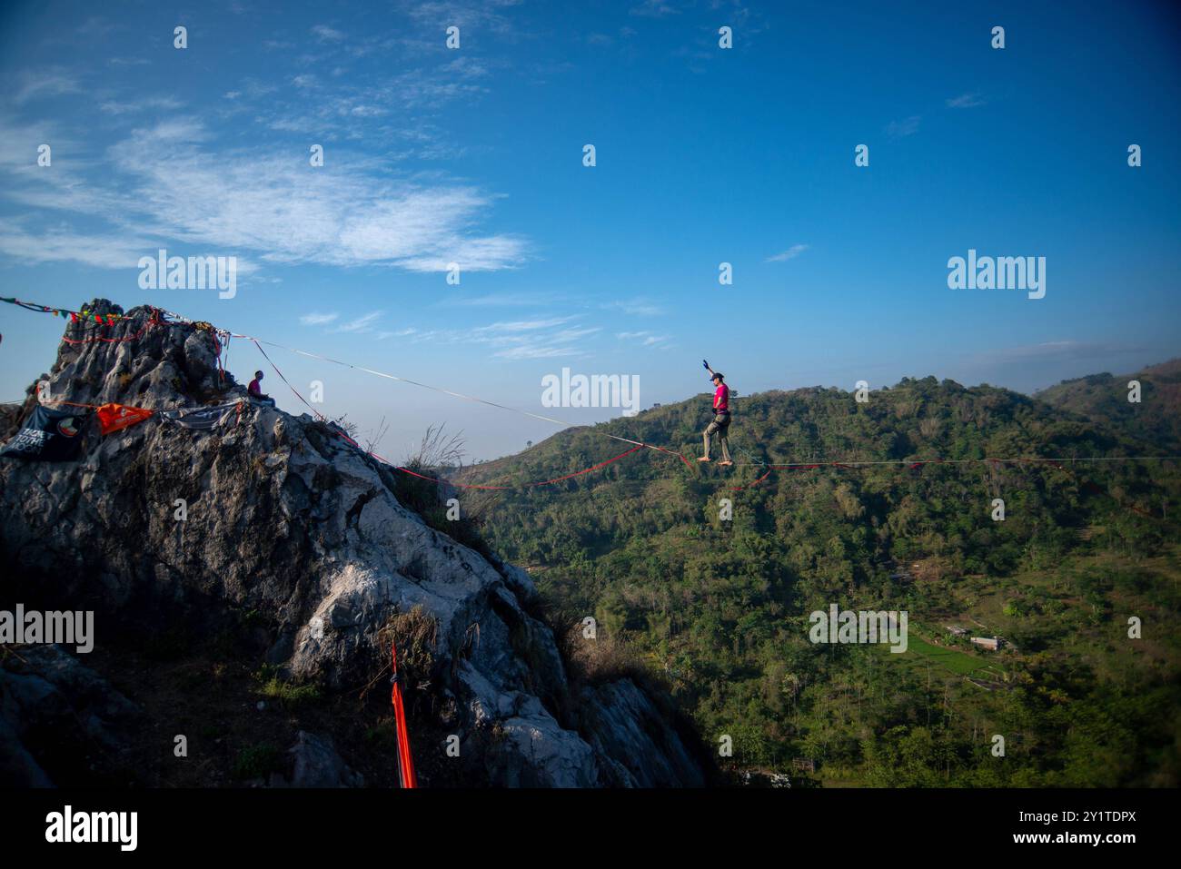 INDONESIA HIGHLINE FESTIVAL Extreme sports athletes walk on a tightrope ...