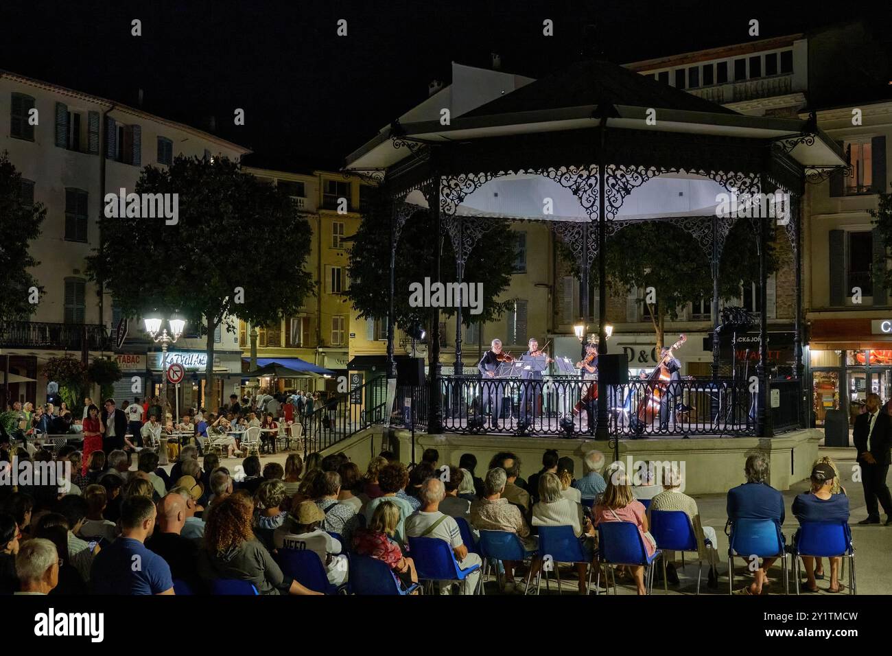 String quartet on the bandstand playing a concerto in the Place ...