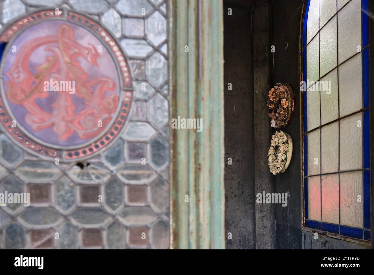 Stained glass window and ceramic wreaths in a mausoleum in the Pere ...