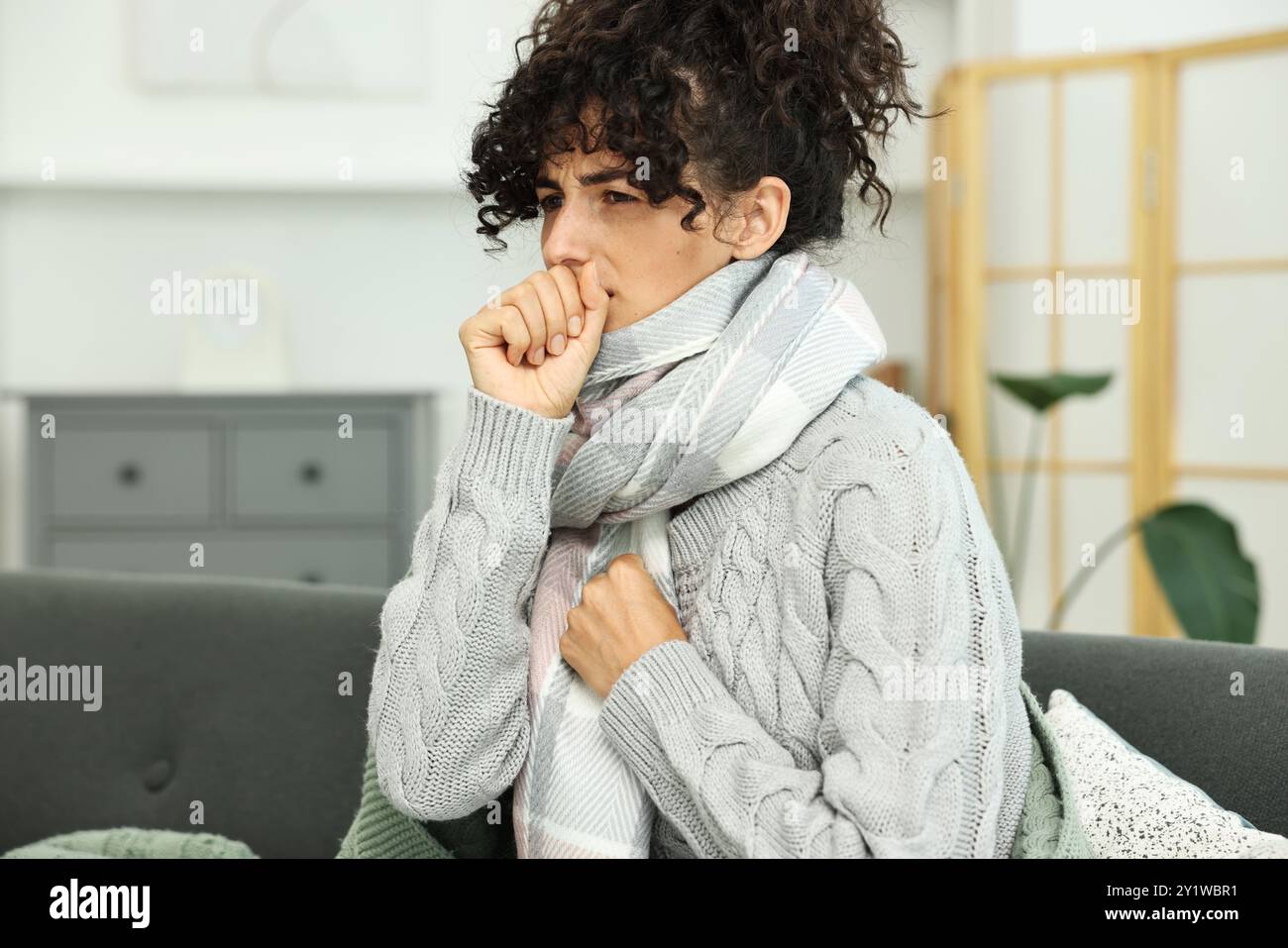 Cold symptom. Young woman suffering from illness at home Stock Photo ...