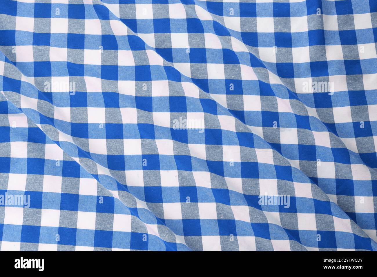 Blue and white checkered gingham fabric as background, closeup Stock ...