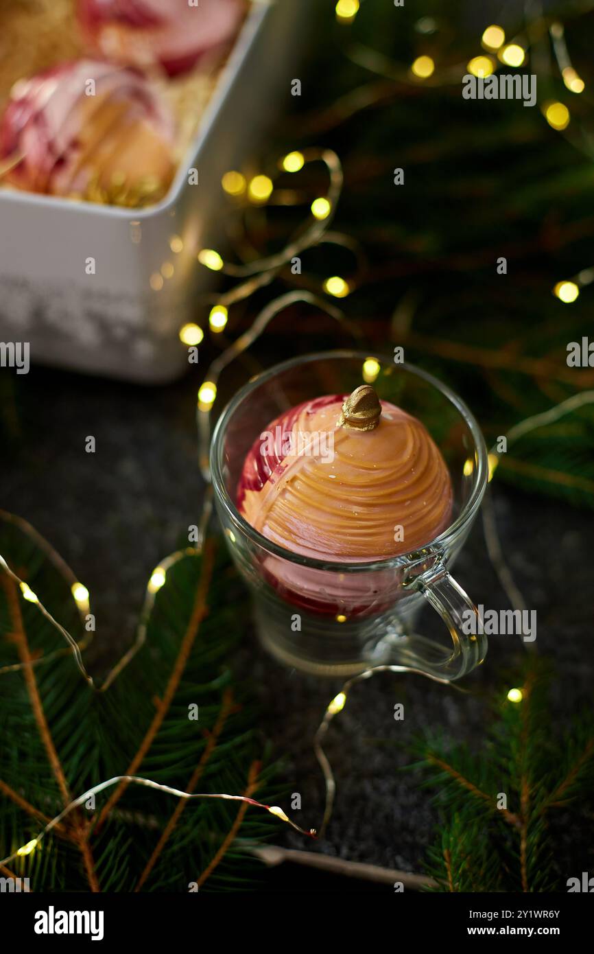 A beautifully presented dessert features a swirl of cream atop a ...