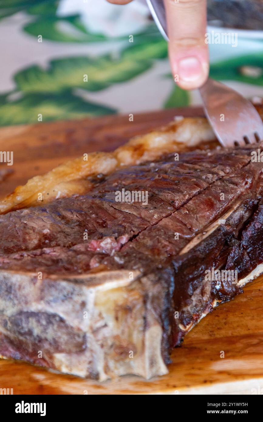 Person cutting up meat hi-res stock photography and images - Alamy