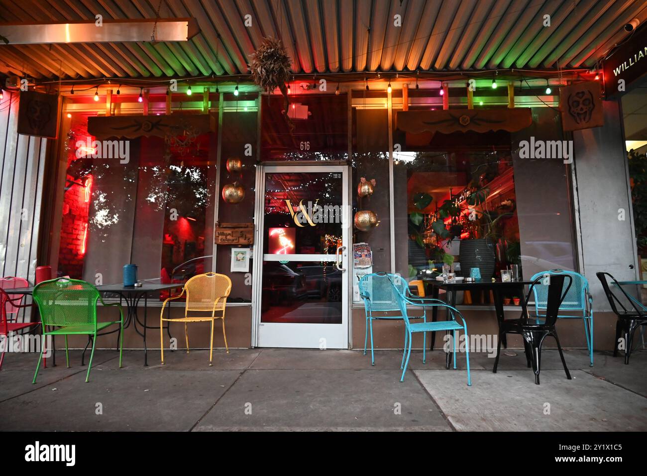 Colorful sidewalk seating under a portico at a restaurant in Raleigh ...