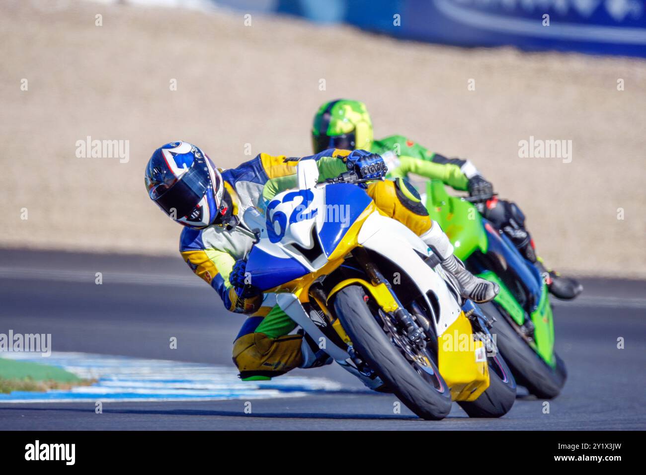 Dynamic shot of professional motorcycle racers in action, speeding ...