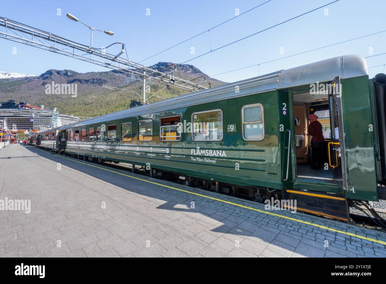 Flam, Norway - May 2, 2024: The Flam Railway winds its way through stunning Norwegian mountains ...