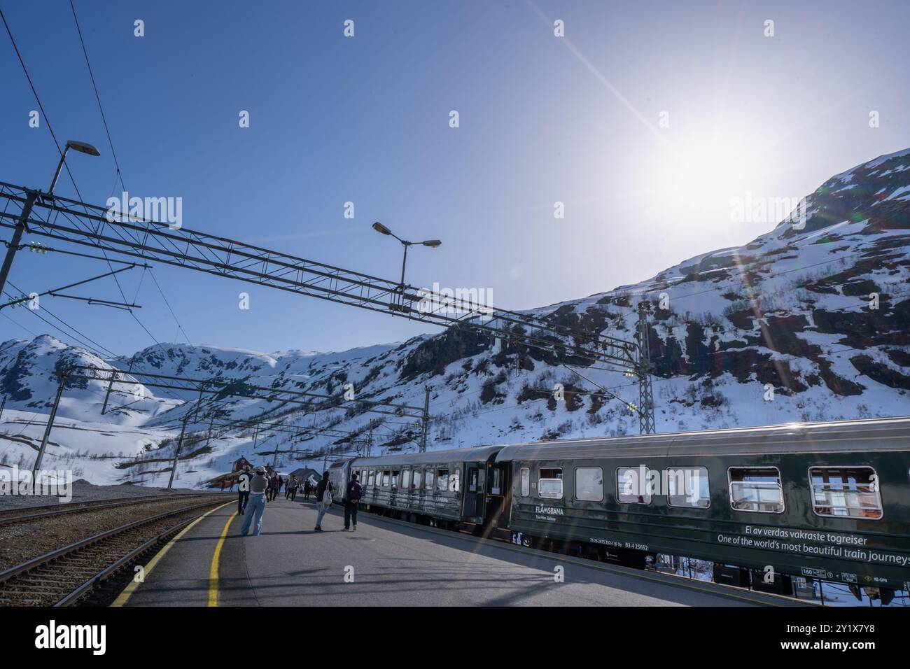 Flam, Norway - May 2, 2024: The Flam Railway winds its way through stunning Norwegian mountains ...