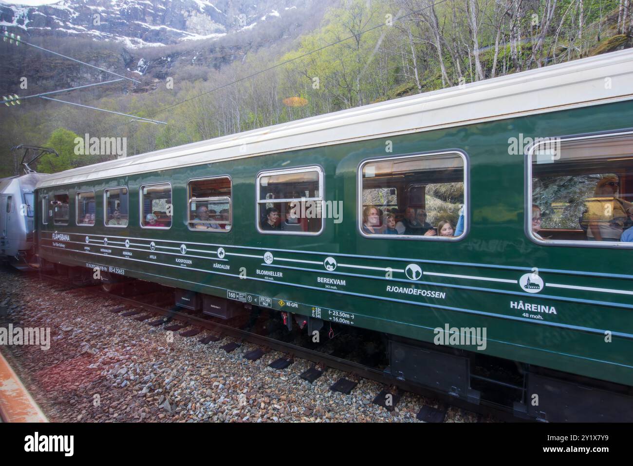 Flam, Norway - May 2, 2024: The Flam Railway winds its way through stunning Norwegian mountains ...