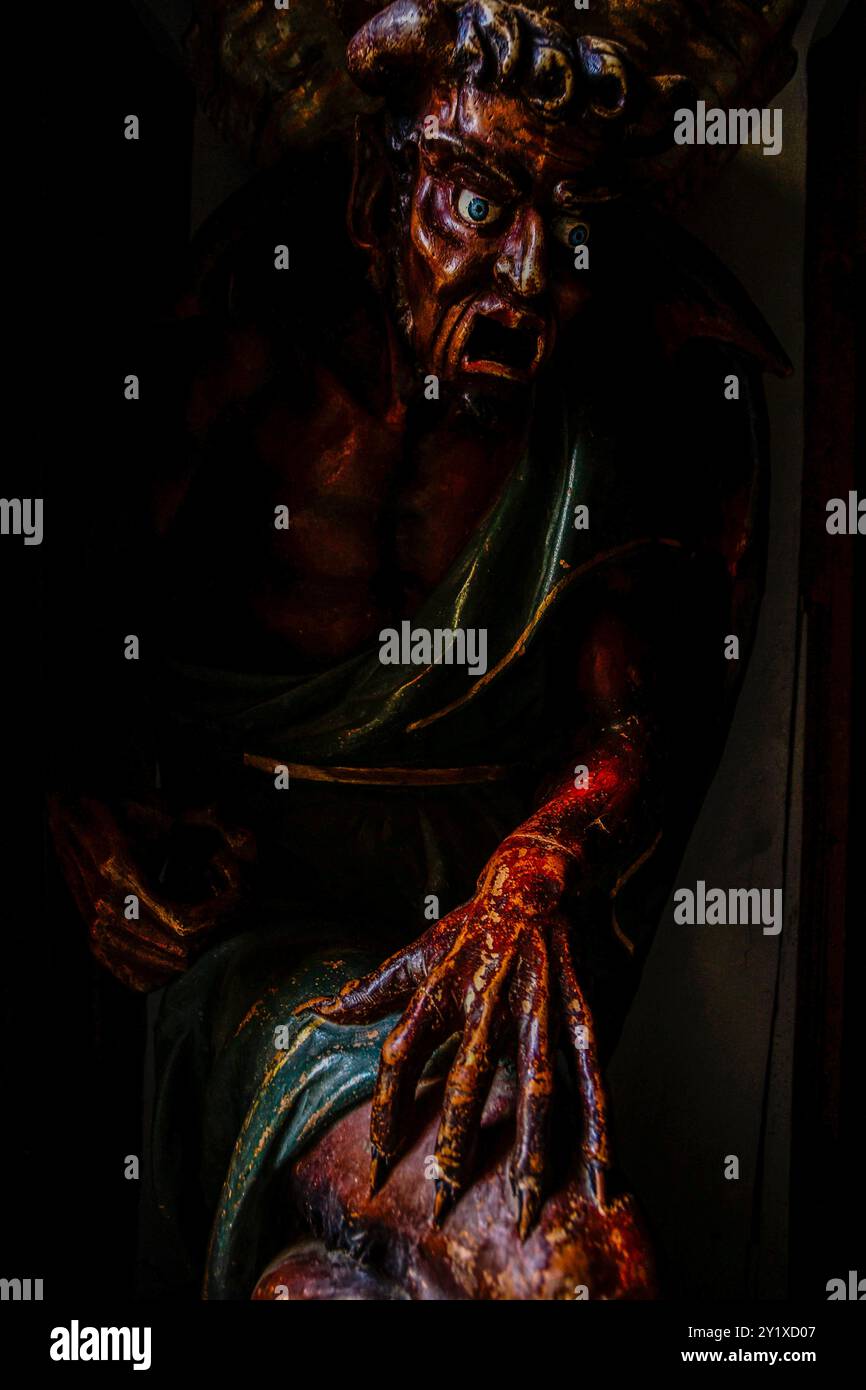 Asmodeus statue of the devil, holding the holy water pile, church of ...