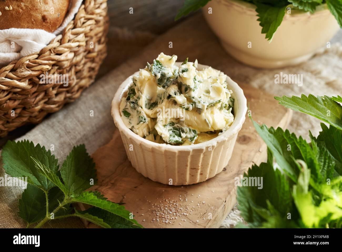 Nettle butter in a bowl - homemade bread spread made of wild edible ...