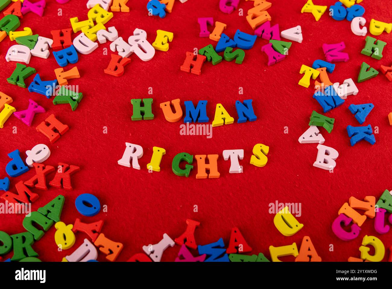 Colorful wooden letters spell "Human Rights" in the center of a vibrant ...