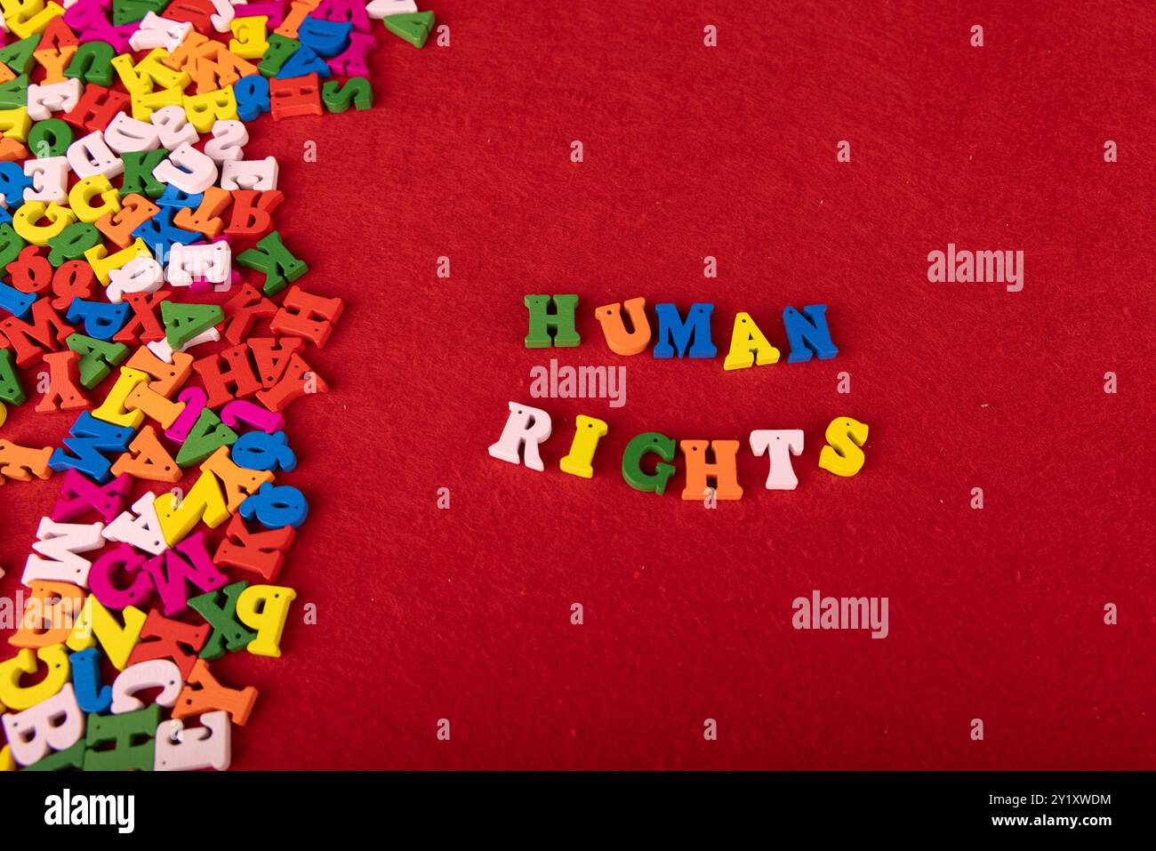 The phrase "Human Rights" stands out in colored wooden letters, with a ...