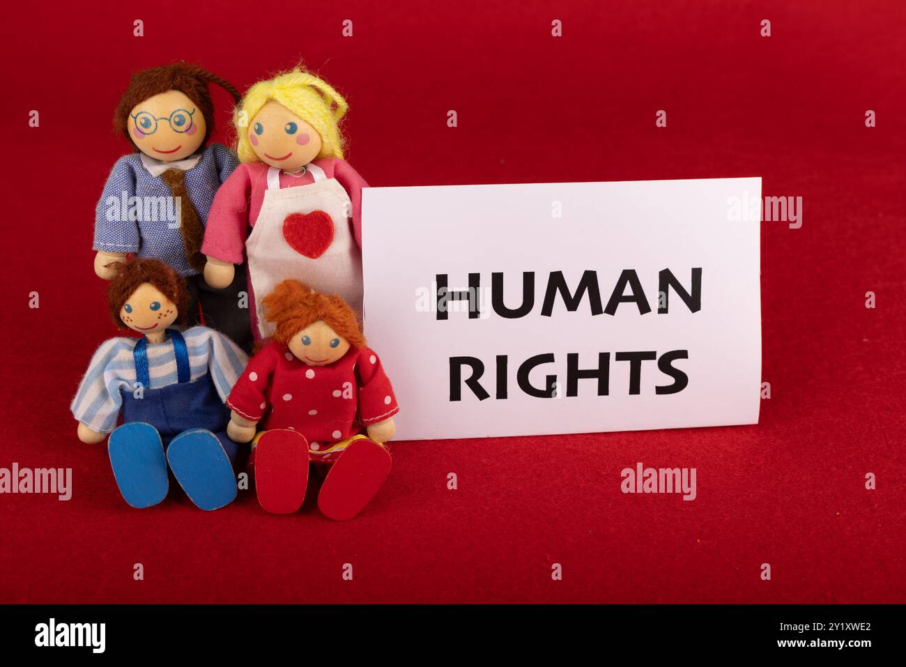 Wooden figurines standing next to a "Human Rights" sign on a striking ...