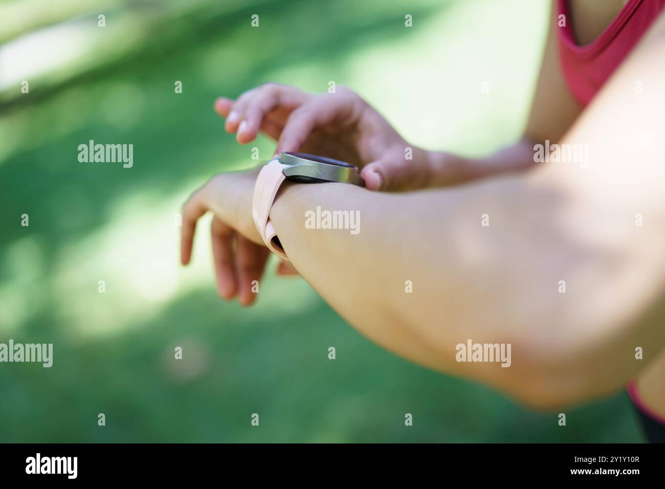 Exercising woman combines fitness with advanced technology, using a ...