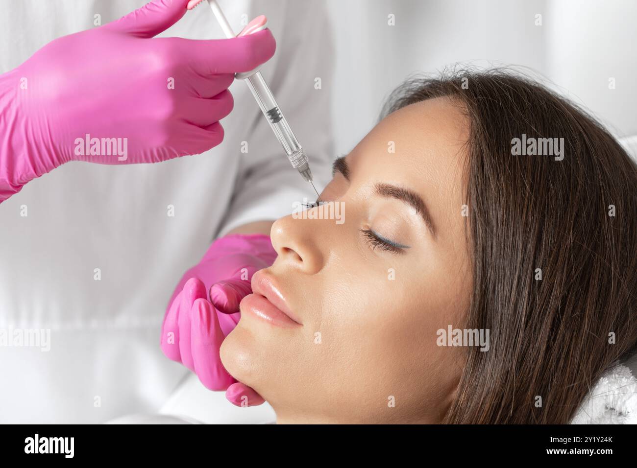 The doctor does injections to correct the hump on the nose with the ...