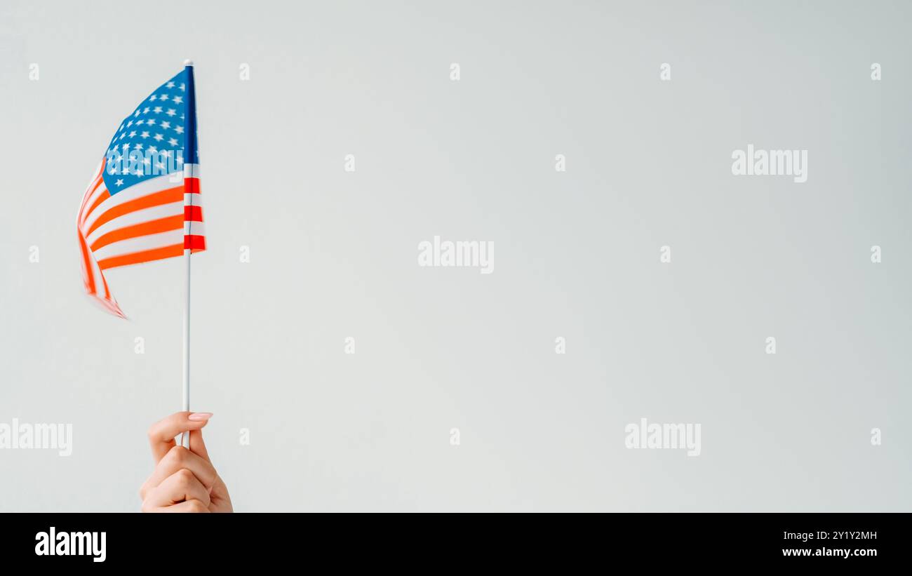 USA flag. Independence day. Female hand waving American national symbol ...