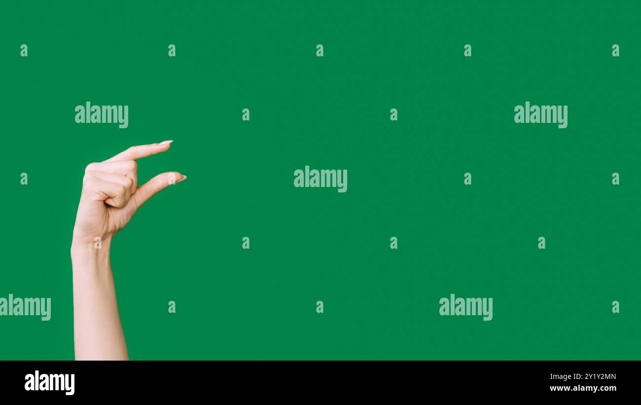 Small gesture. Finger measuring. Little bit. Female hand showing tiny ...