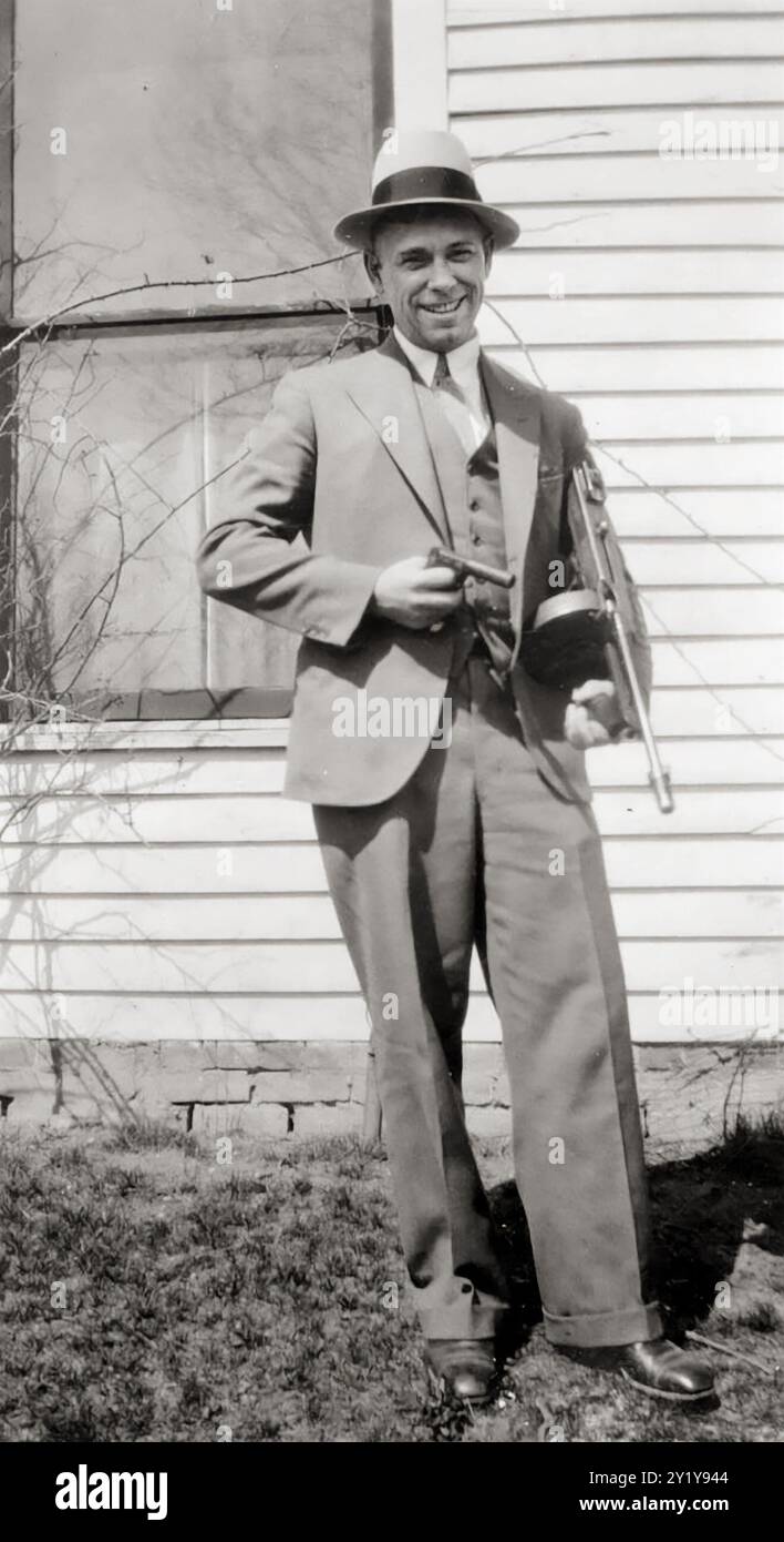 John Dillinger with guns. Dillinger was a famous bank robber and ...