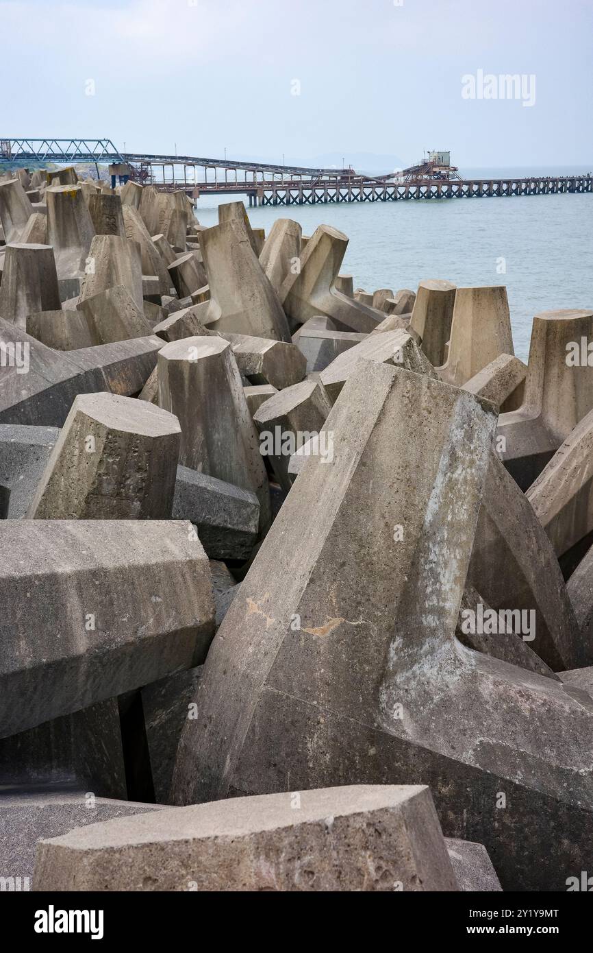 man made concrete sea wall defence defending the shore from the power ...