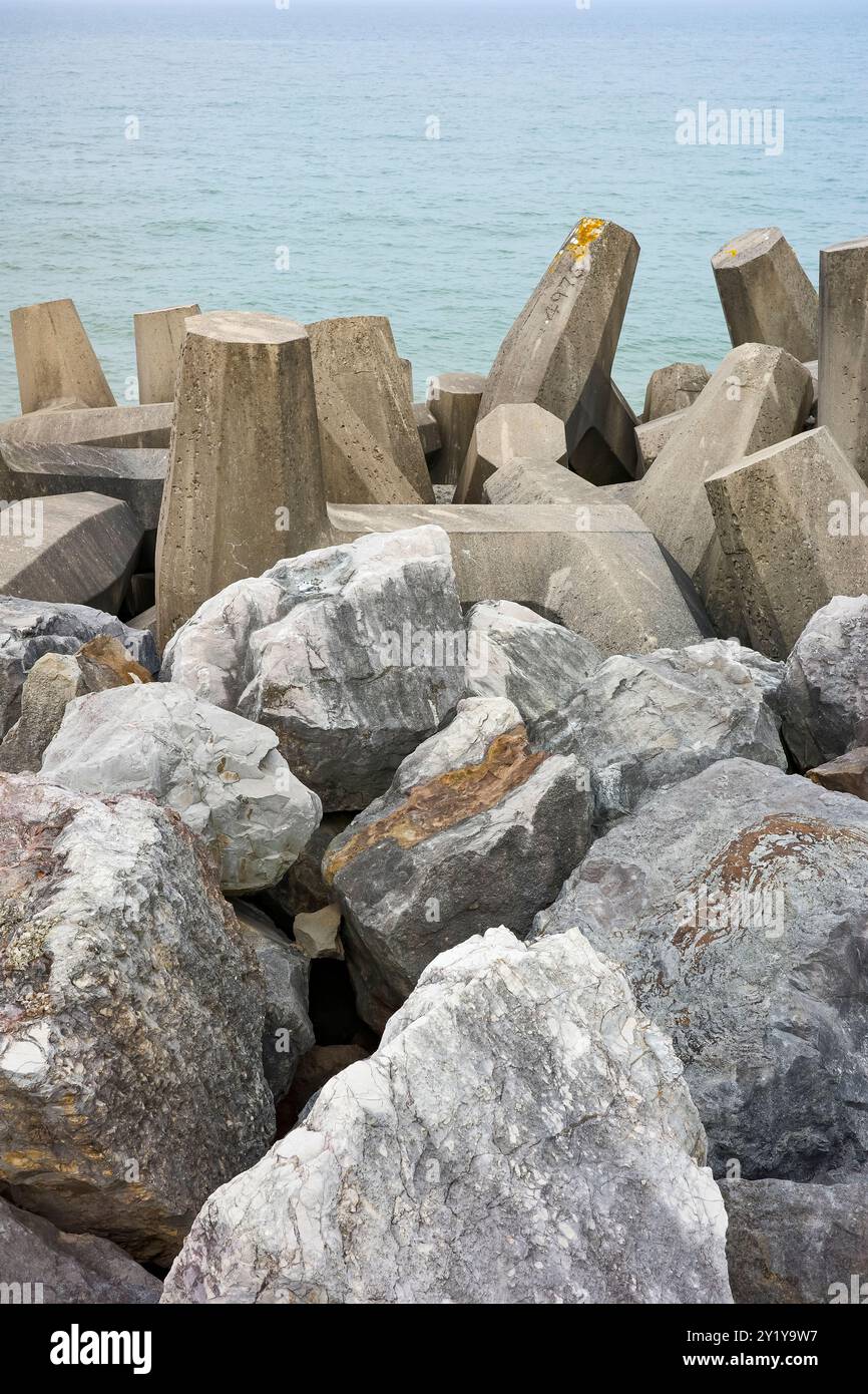man made concrete sea wall defence defending the shore from the power ...