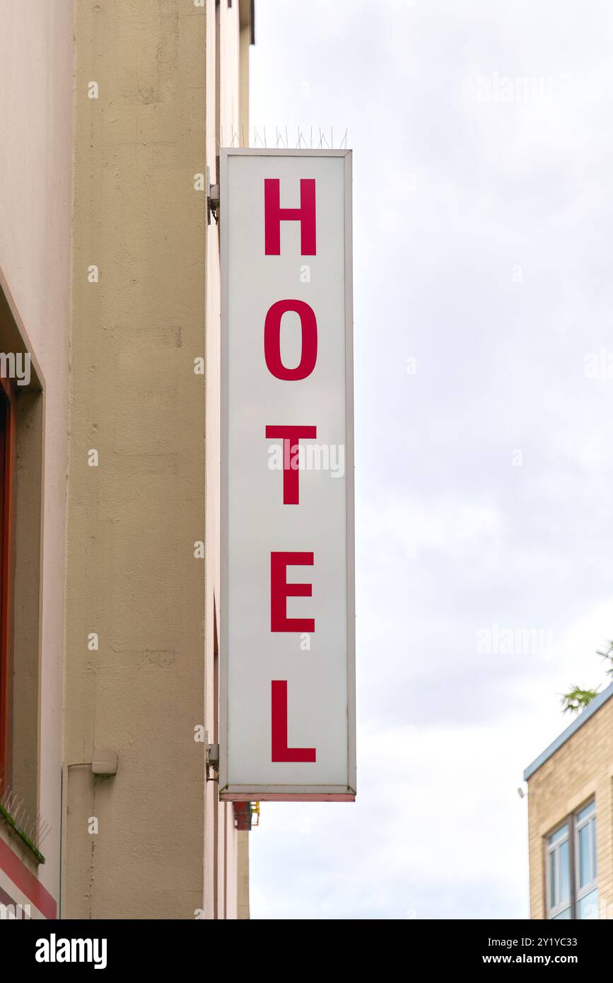 Illuminated sign for a hotel in the old town of Cologne in Germany ...