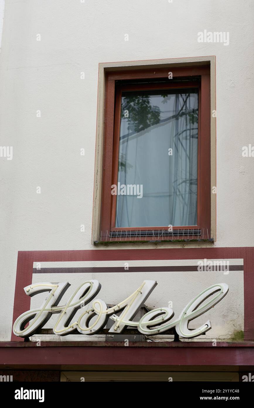 Illuminated sign for a hotel in the old town of Cologne in Germany ...