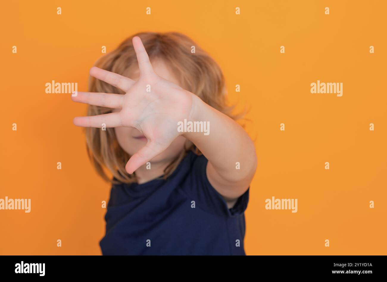 Kid making stop gesture on isolated studio background. Kid showing ...