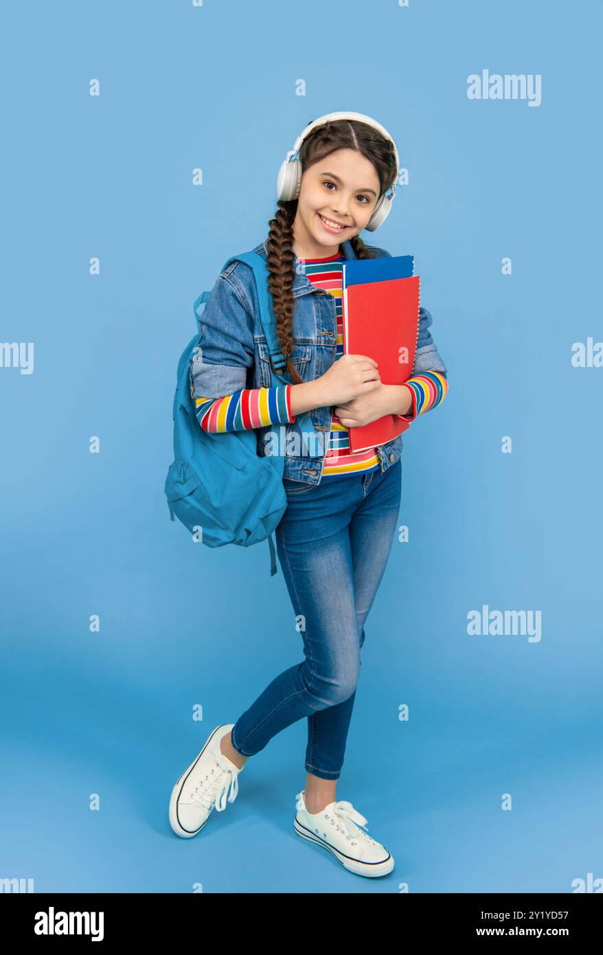 Happy teenager going to music school. Teen girl listening to music ...