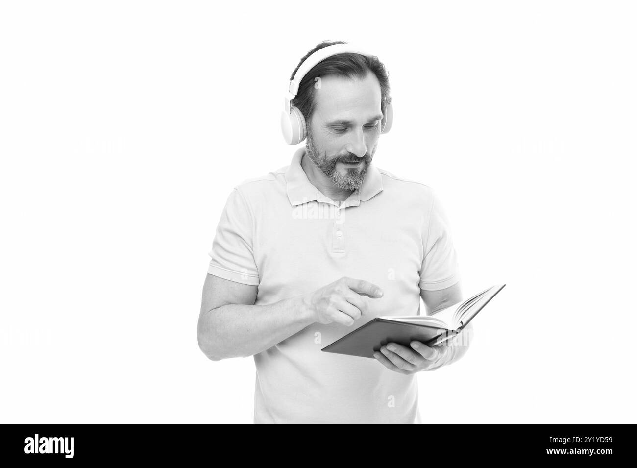 busy man reading elearning in headphones isolated on white. man reading ...