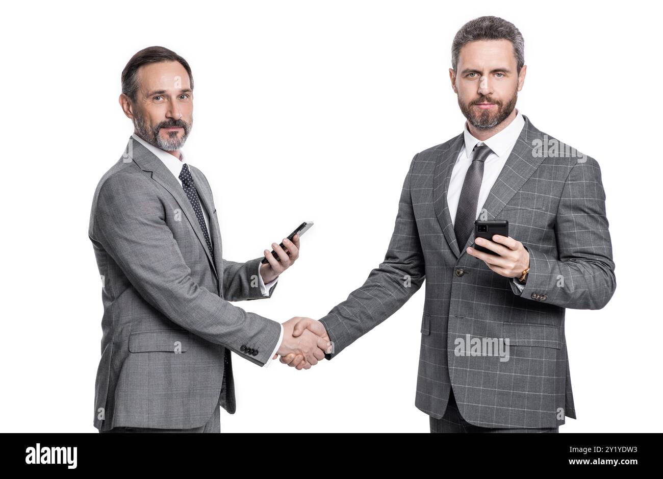 men texting message with handshake in studio. men texting message on ...