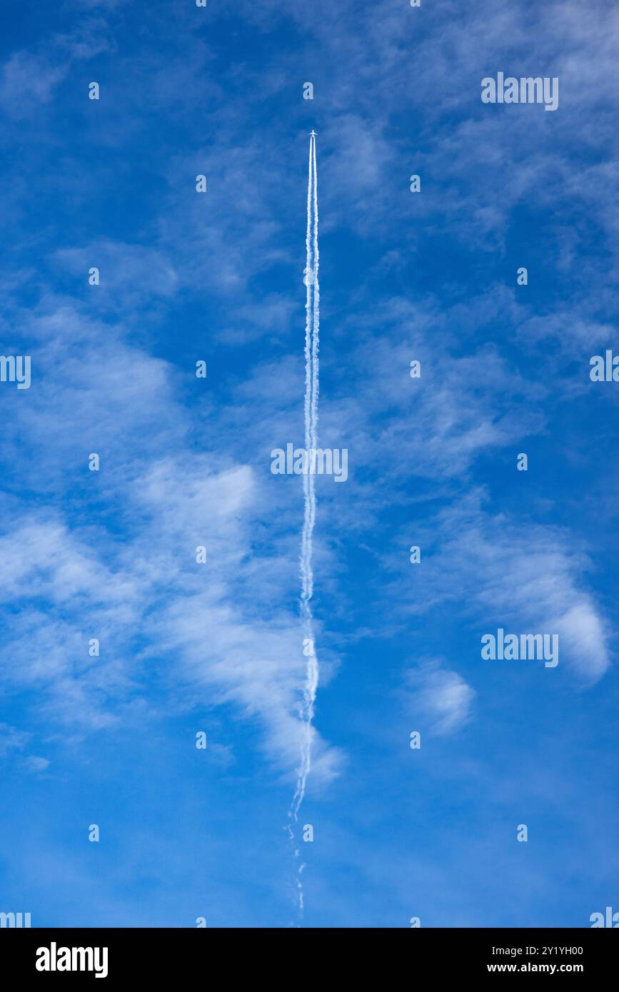 Passenger Jet Airplane Airline Plane Flting Leaving Vapor Trails in a ...